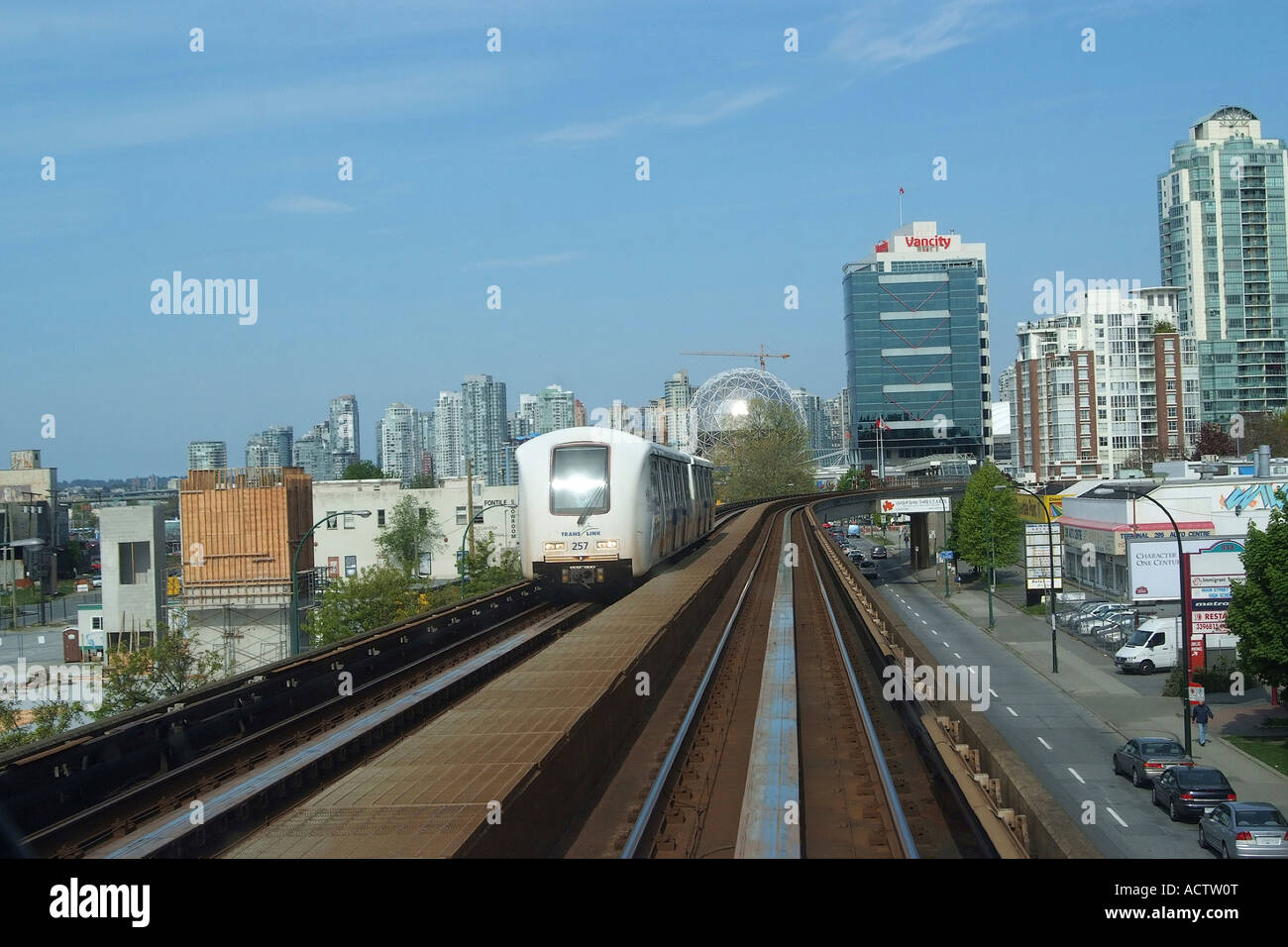 A VIEW OF RAIL ROAD TRACKS LEADING TO DOWNTOWN VANCOUVER FROM INSIDE AN ...