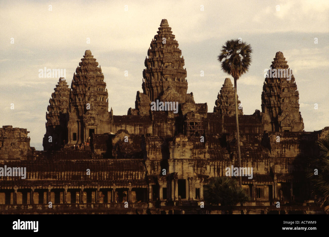 A frontal view of Angkor Wat at sunset. The temple is architecturally ...
