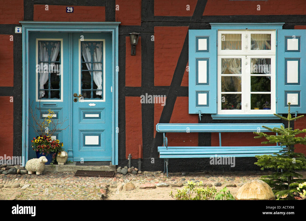 Colored entrance door and windows at a typical house at Wustrow ...
