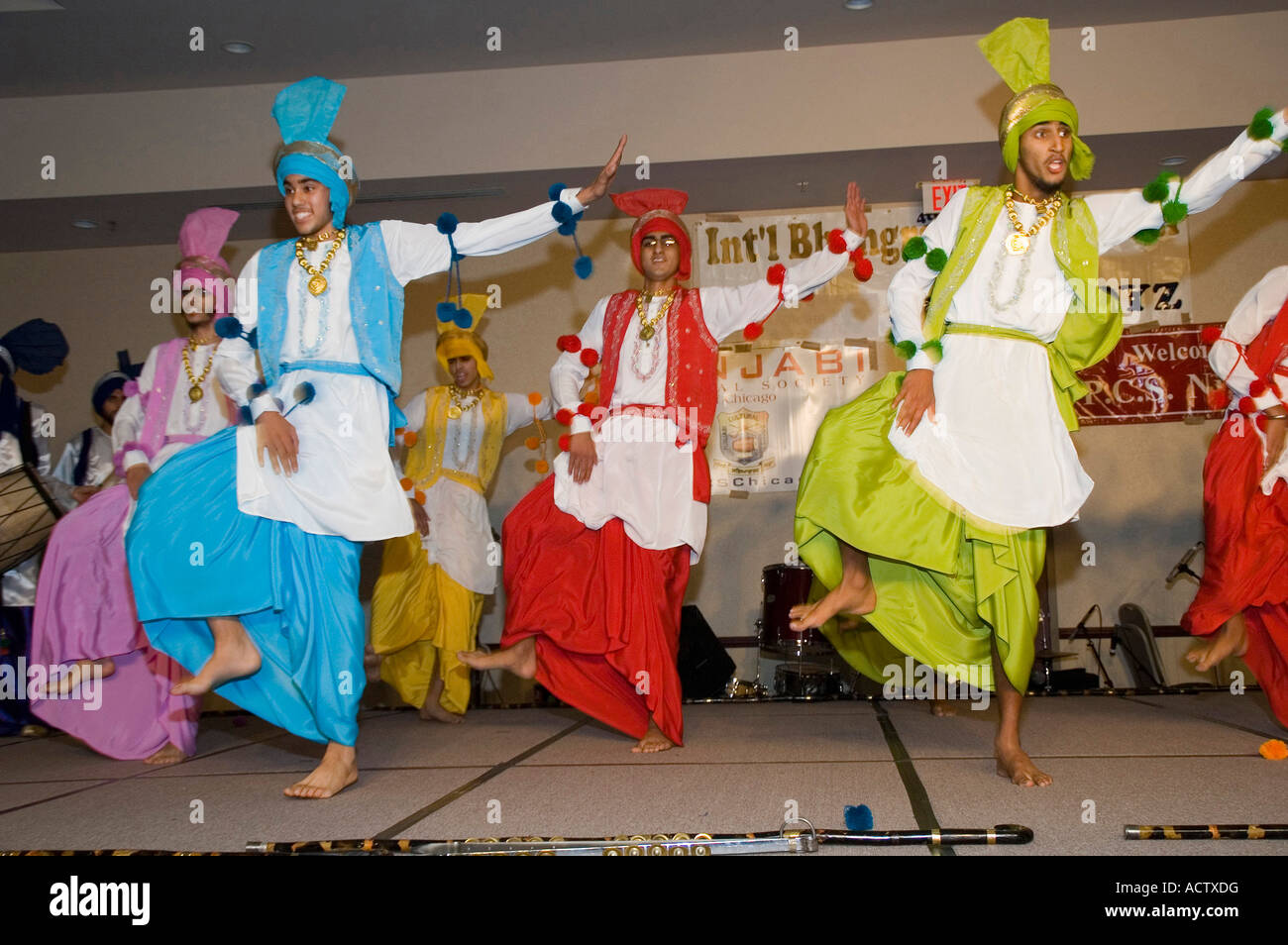 BHANGRA PERFORMANCE BY MEN IN MULTI COLOR DRESSES Stock Photo - Alamy