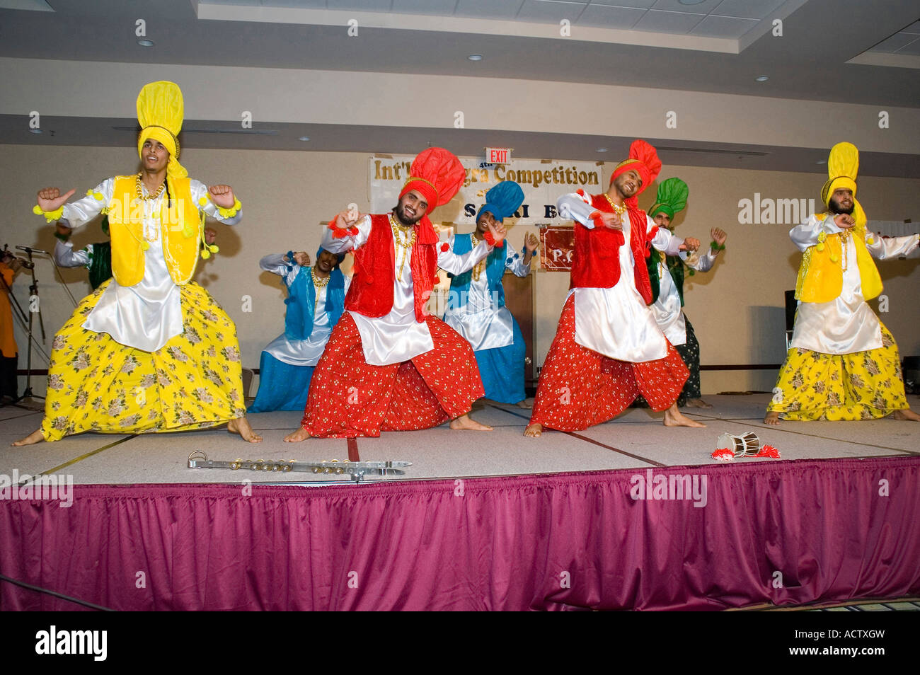 RED YELLOW BLUE AND GREEN UNIFORM BHANGRA DANCERS IN ACTION Stock Photo ...