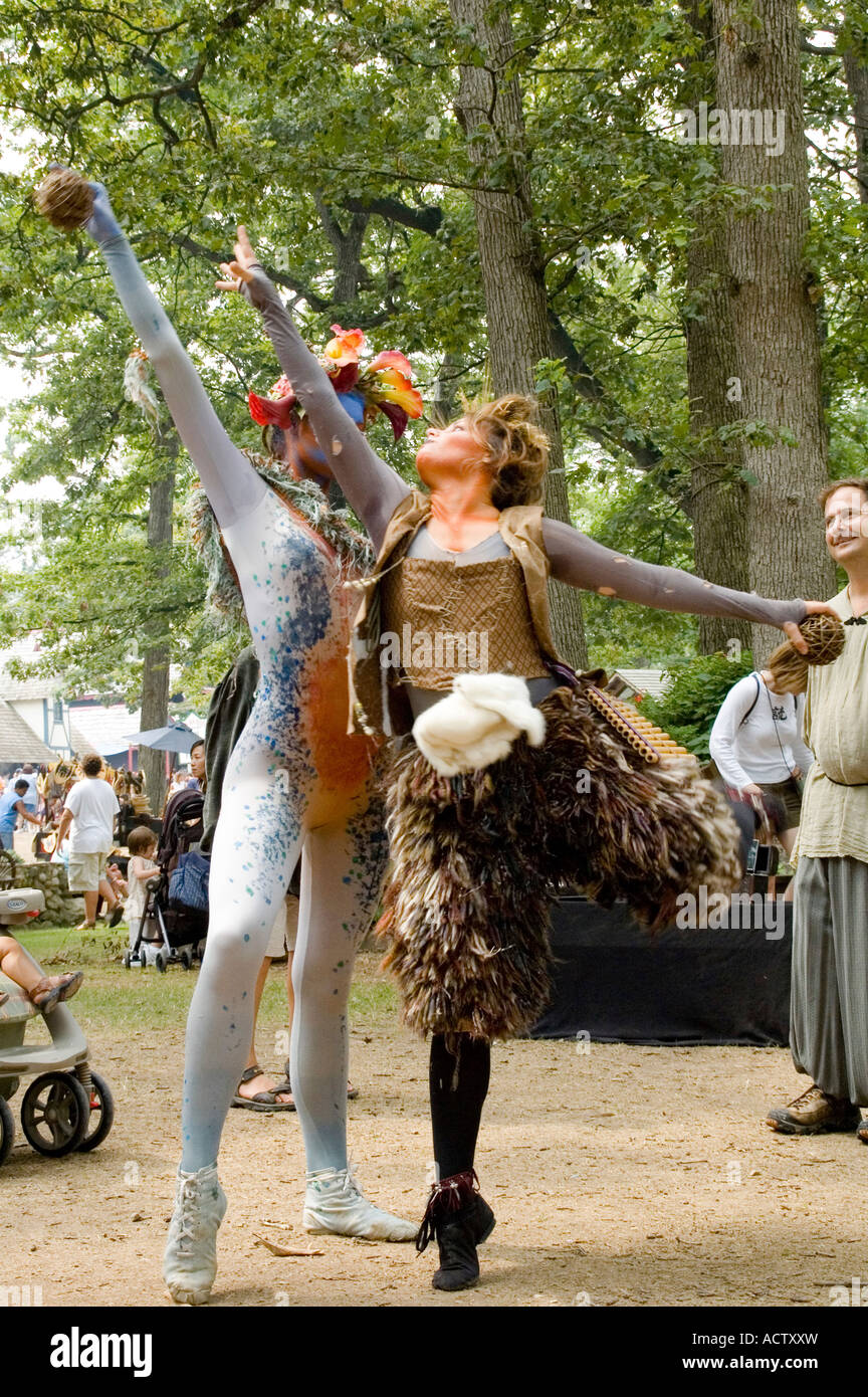 TWO WOMEN ACTING IN UNISON IN MIME AT RENAISSANCE FAIR Stock Photo - Alamy