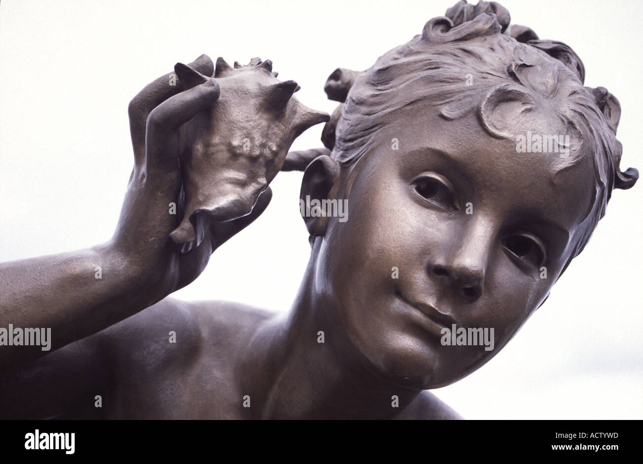 A statue of a girl listening to a shell decorates the Le Pont Alexandre ...