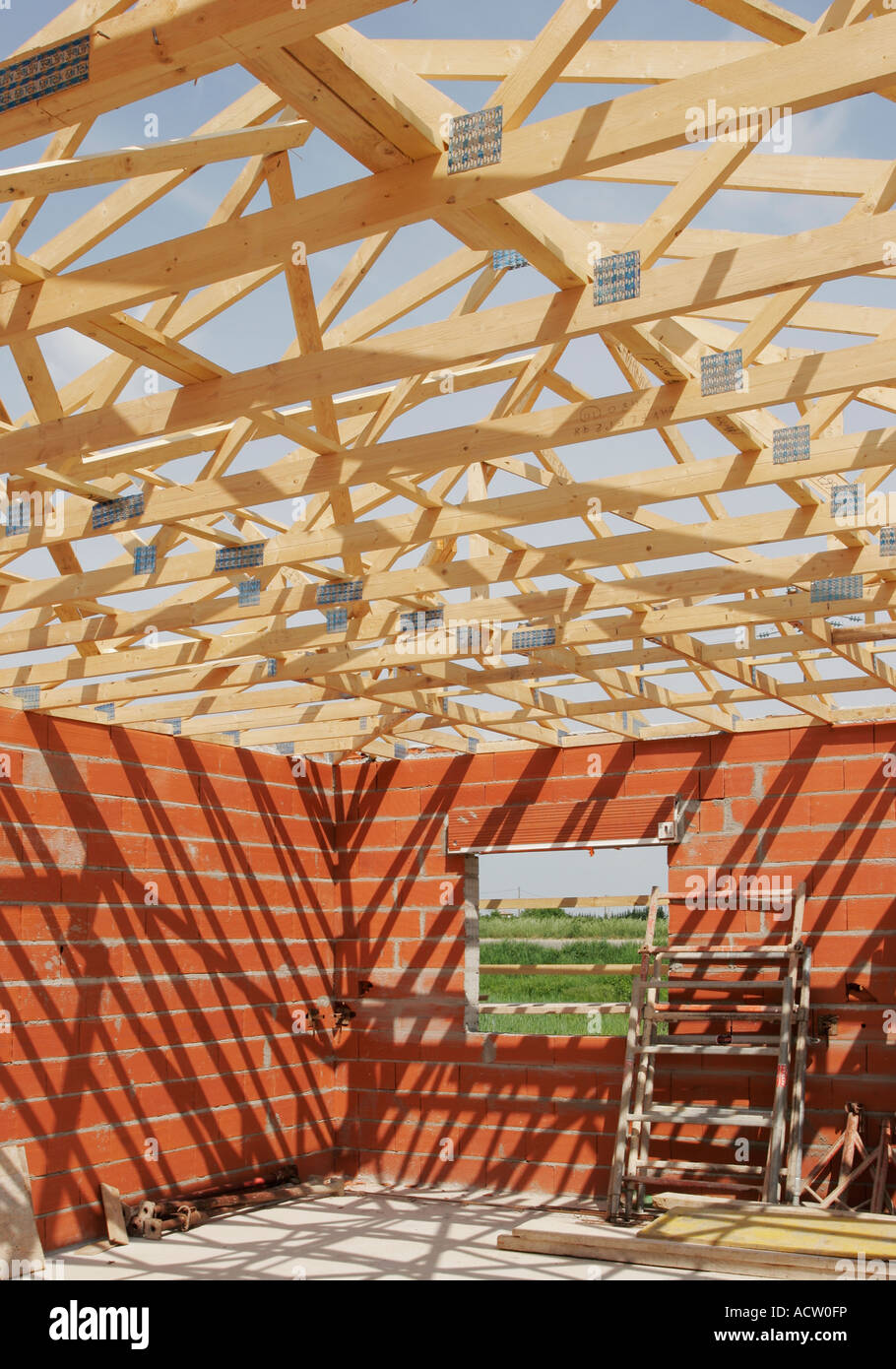 Wooden A frame roof truss construction on a small house Stock Photo - Alamy