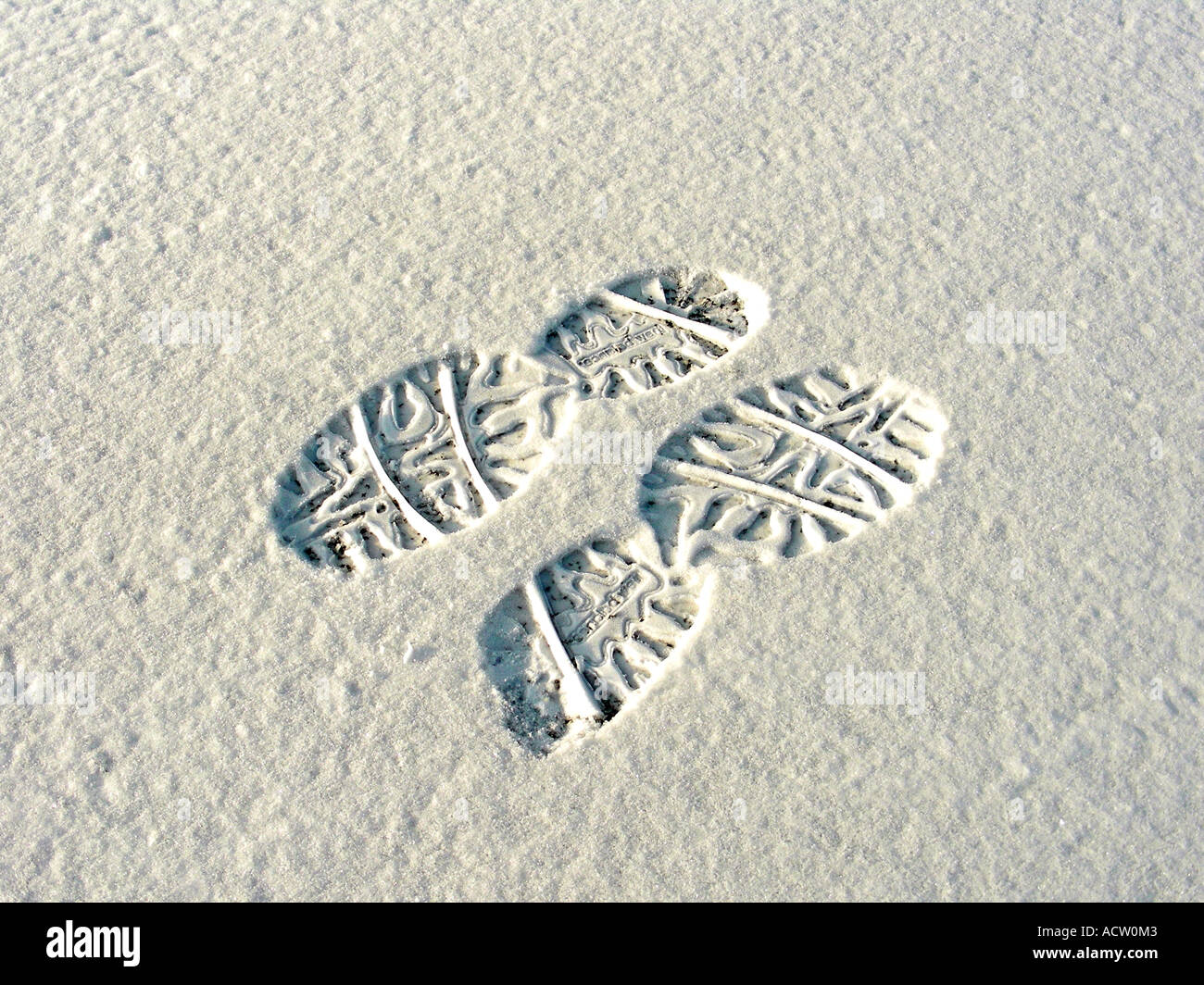 Bootprints in snow Stock Photo - Alamy