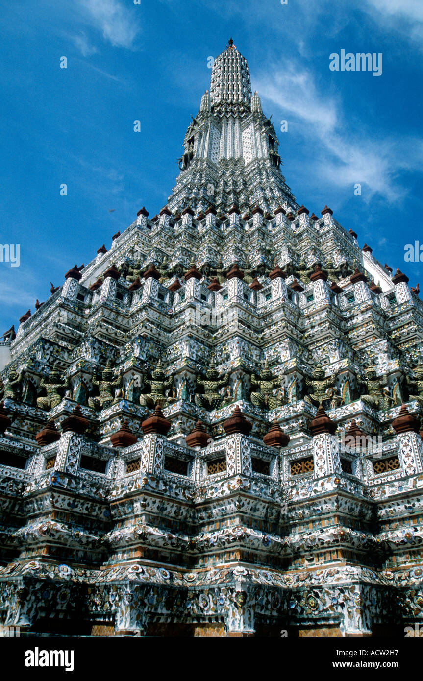 A tall ornate spire of the Wat Arun Buddhist Temple in Bangkok ...