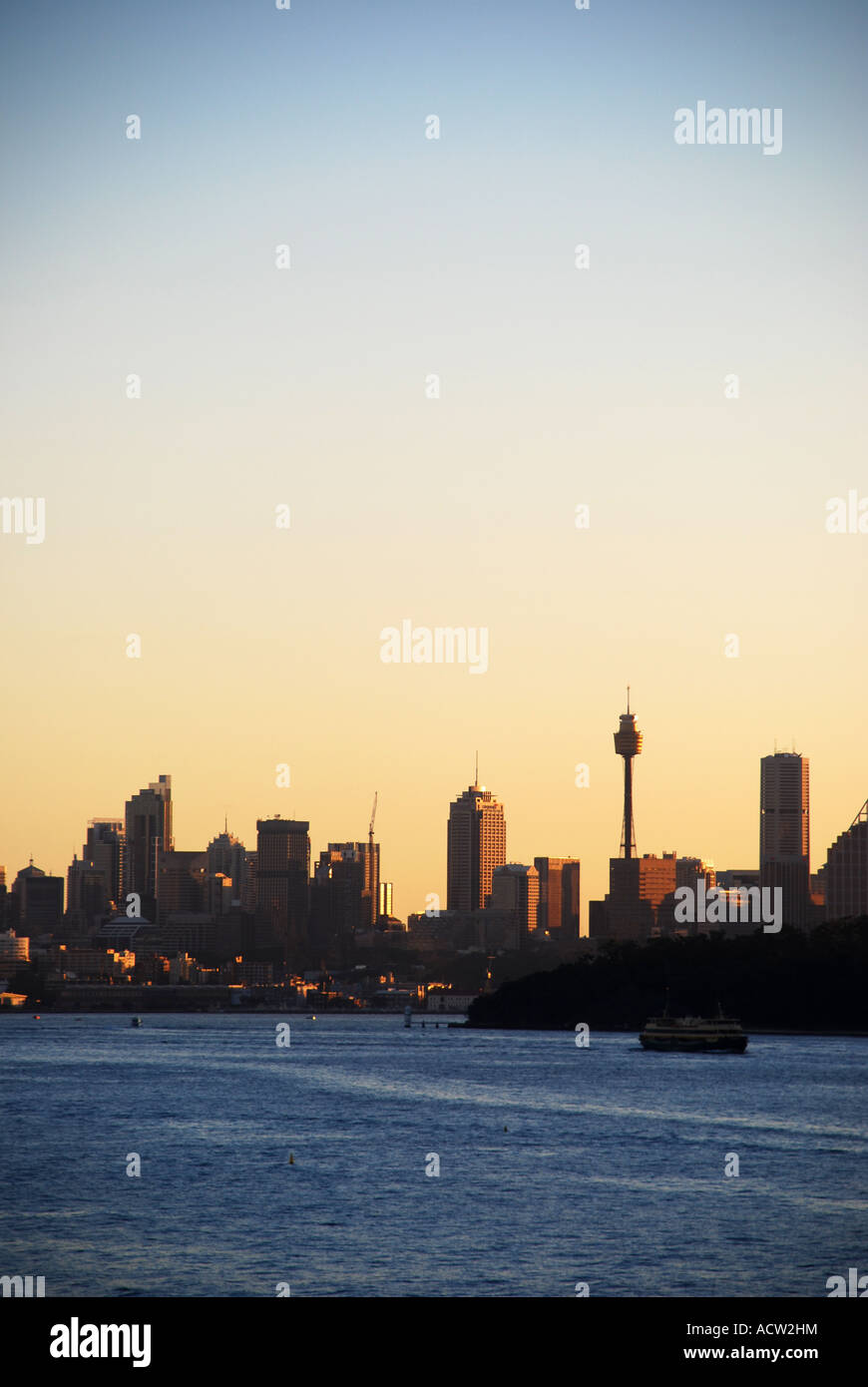 SYDNEY CITY CBD AT SUNSET WITH MANLY FERRY IN FORGROUND ELIZABETH BAY ...