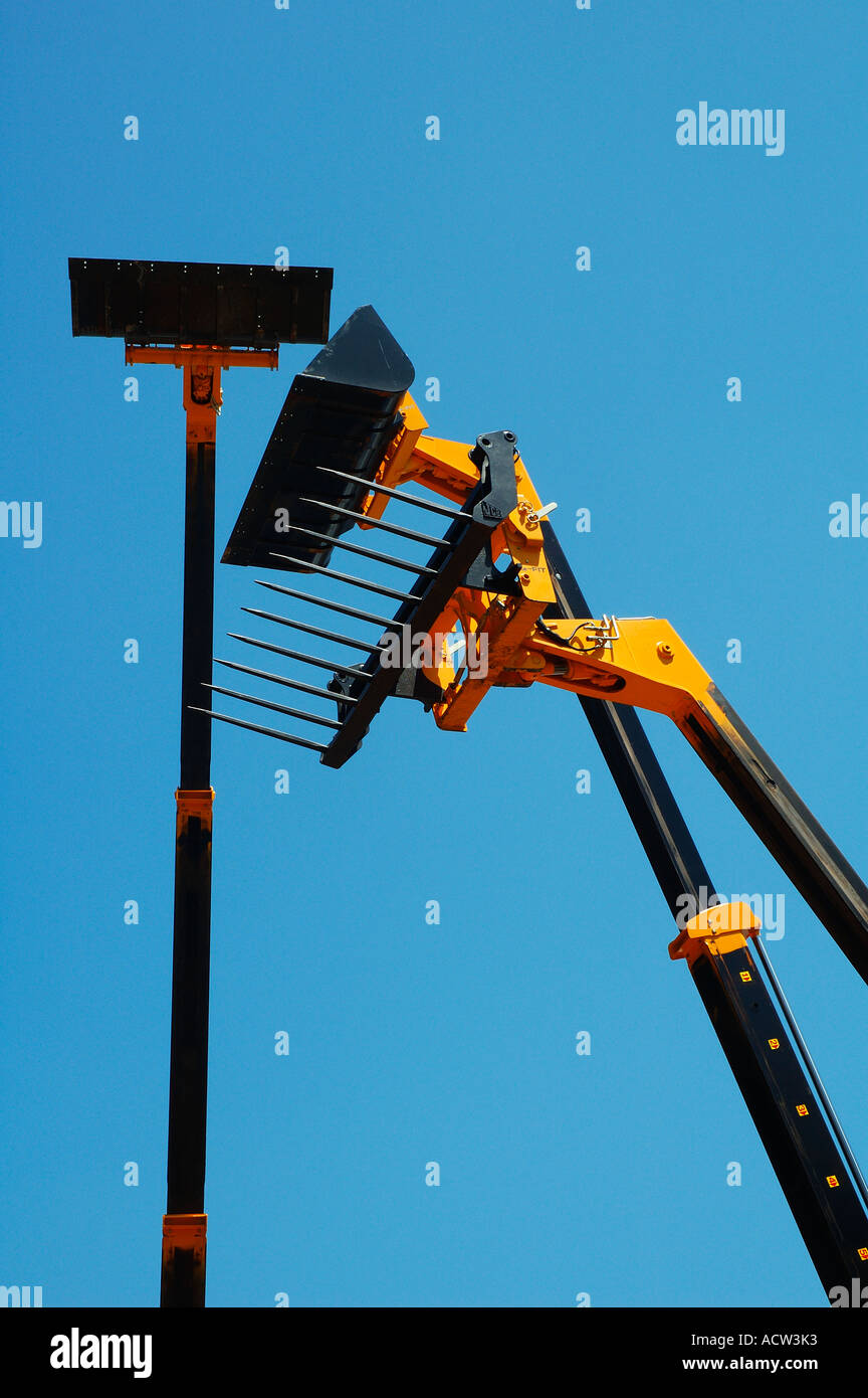 Collection of tractor bucket arms Stock Photo - Alamy