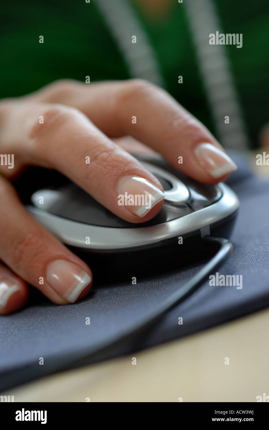 Womans hand using a computer mouse with scroll wheel in an office Stock ...