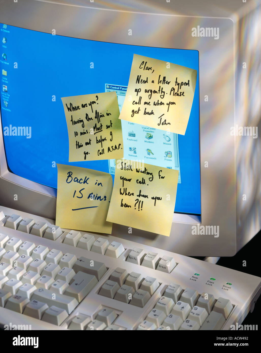 Written messages stuck on computer screen Stock Photo - Alamy