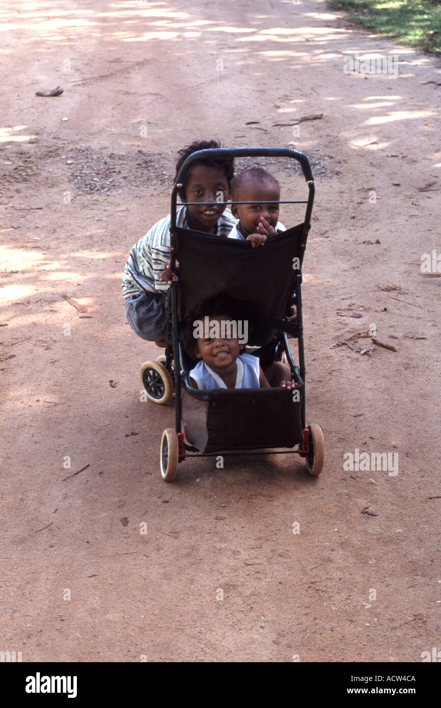 Children playing with Pram Belize Central America Stock Photo - Alamy