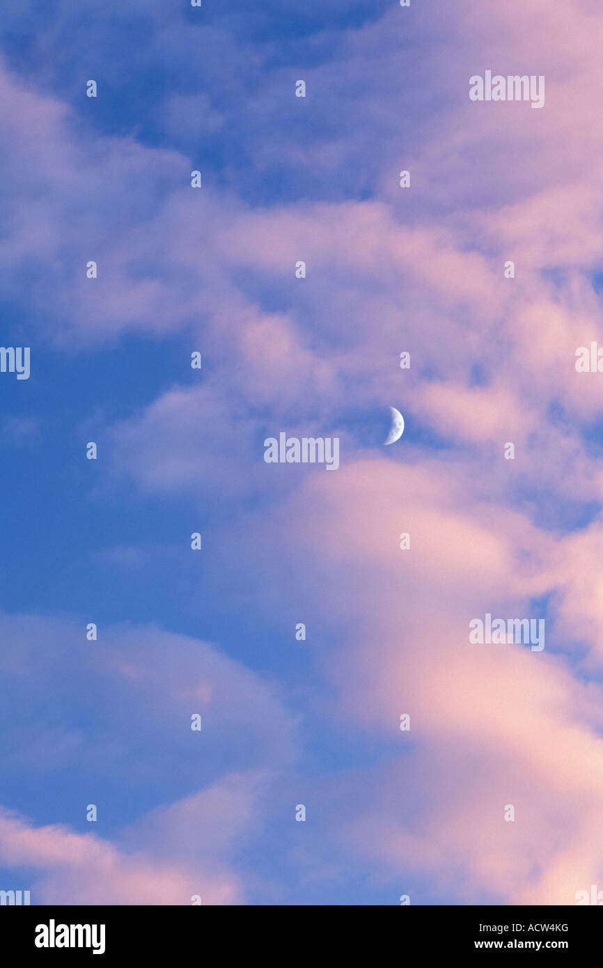 Blue sky with crescent moon and clouds at nightfall Stock Photo - Alamy