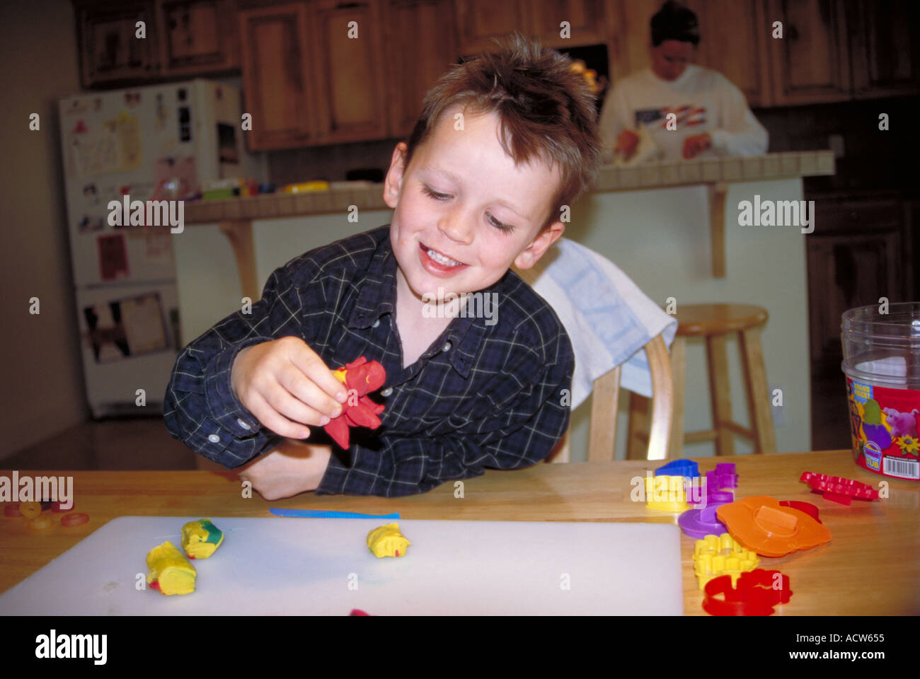 Child Playing with Clay Stock Photo - Alamy