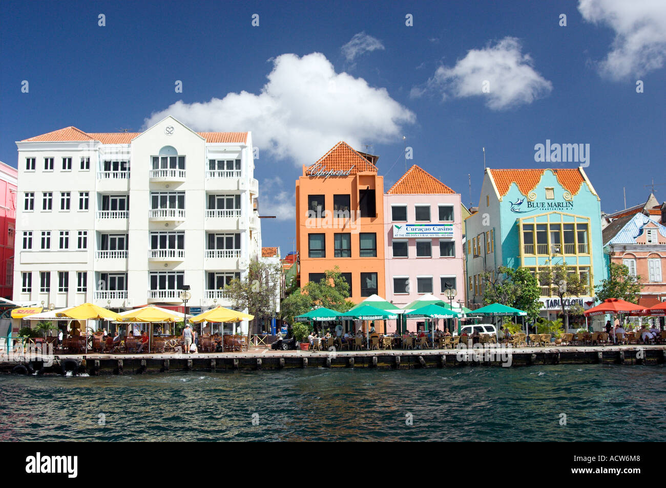 Brightly colored buildings with Dutch colonial architecture line the ...