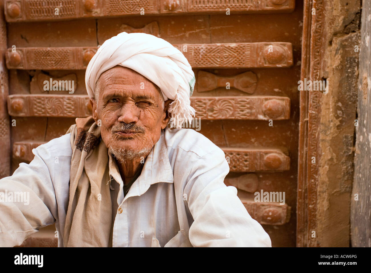 Elderly man winking to the camera in the streets of Shibam Yemen Stock ...