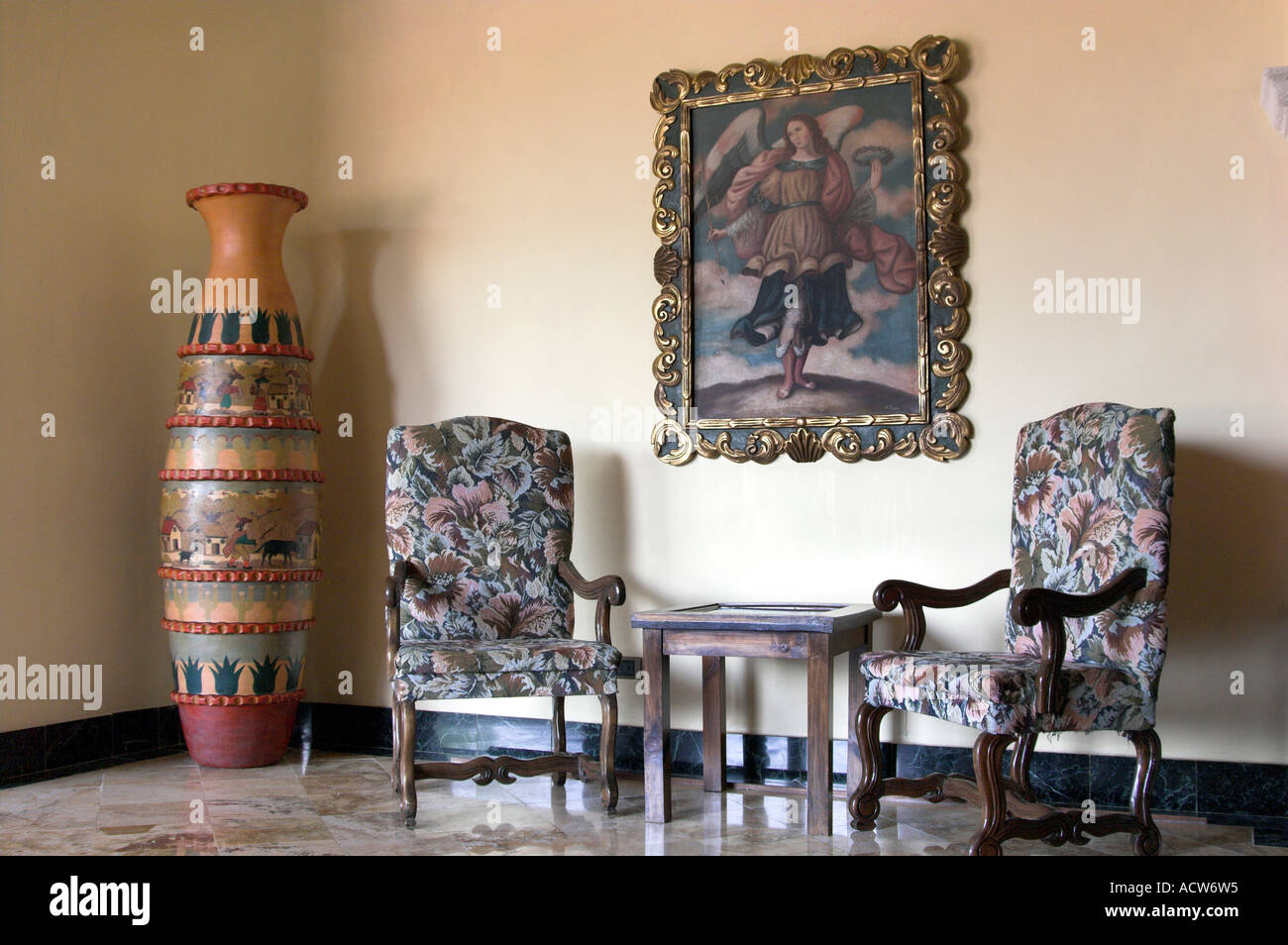 An informal sitting area with artwork and ceramic pottery at the Melia ...