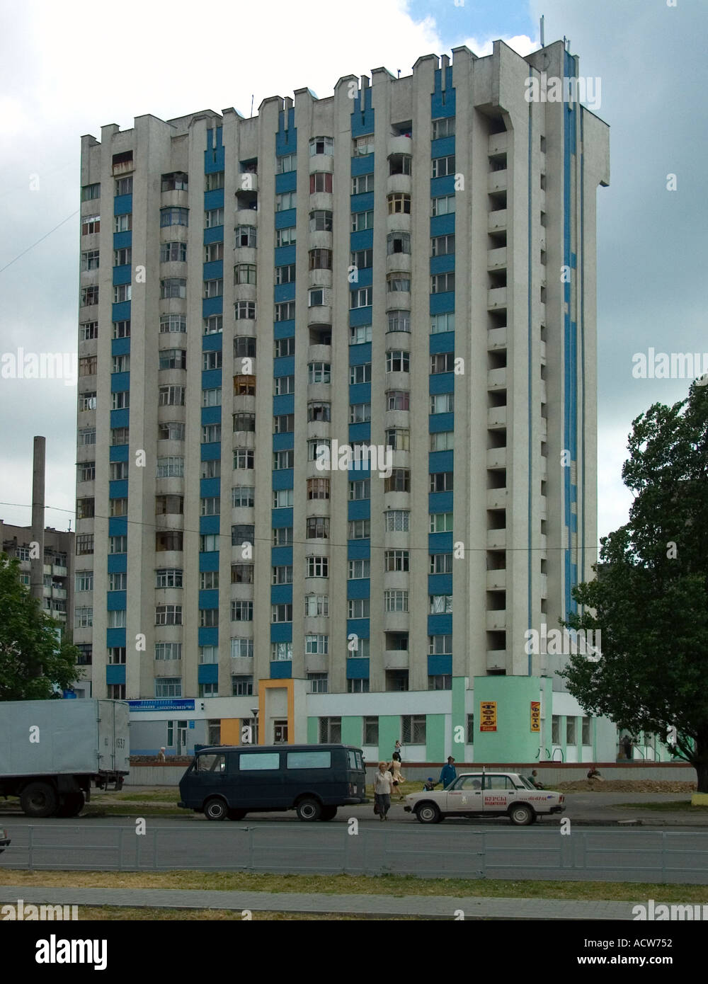 Private residential apartment block with car, van and lorry parked ...