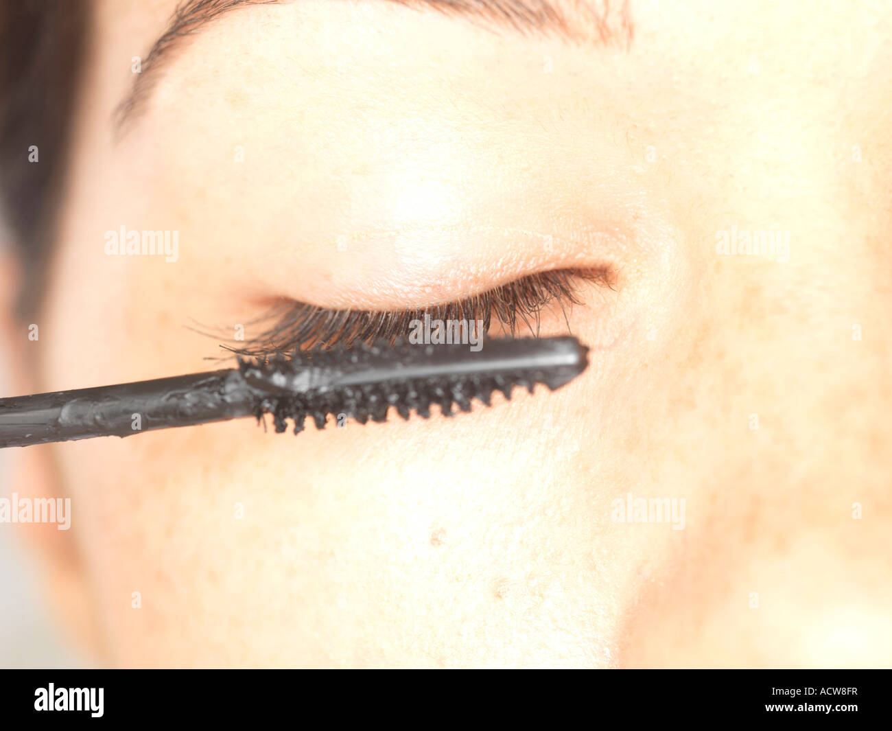 Young Woman Applying Eye Mascara Model Released Stock Photo - Alamy