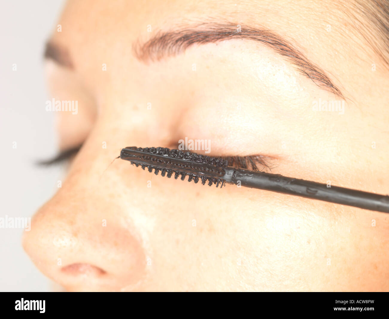 Young Woman Applying Eye Mascara Model Released Stock Photo - Alamy