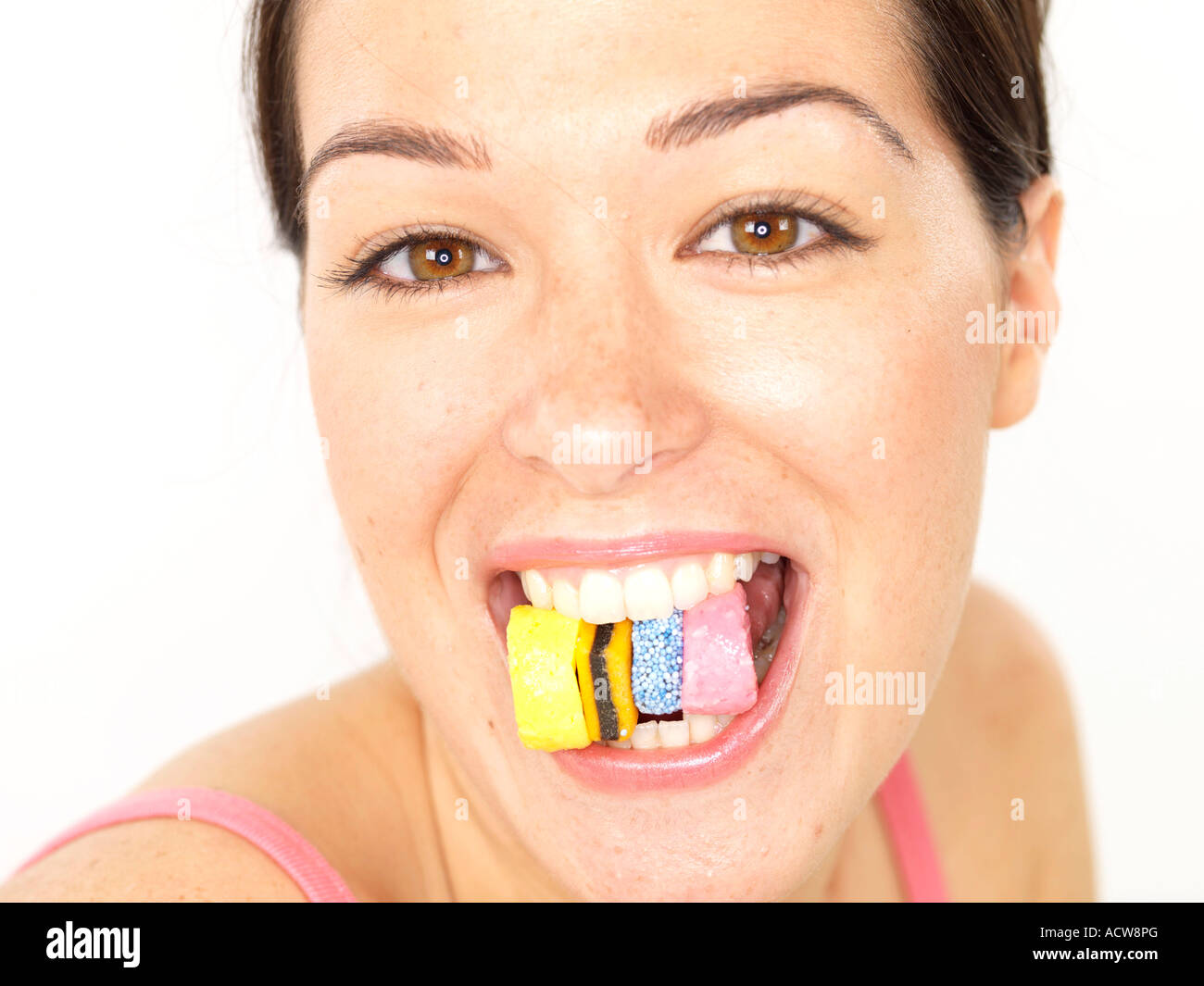 Young Woman Eating Sweets Model Released Stock Photo - Alamy