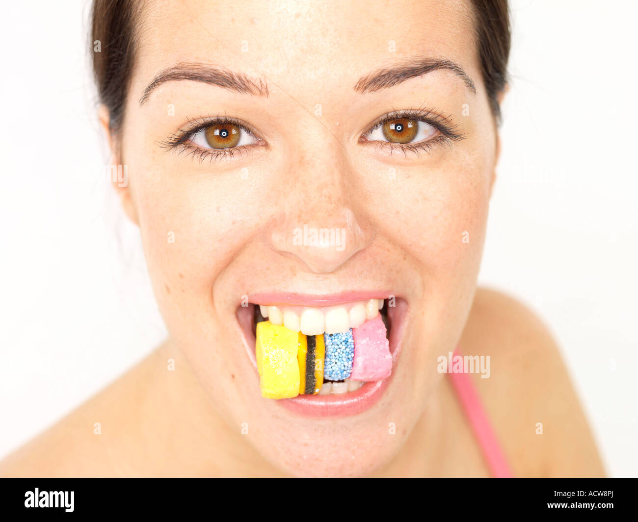 Young Woman Eating Sweets Model Released Stock Photo - Alamy