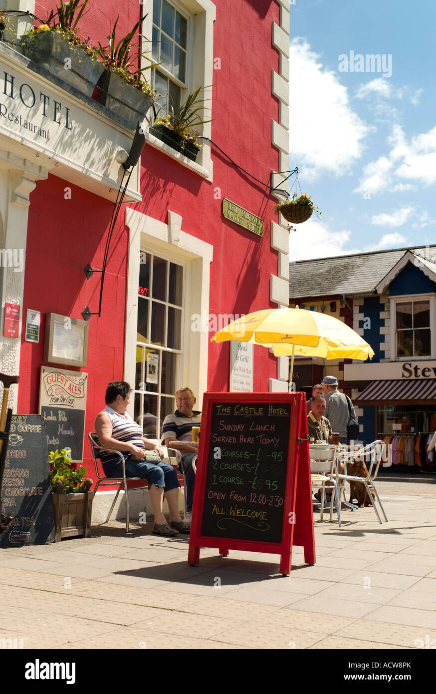 people sitting in the sunshine outside the Castle Hotel Aberaeron ...