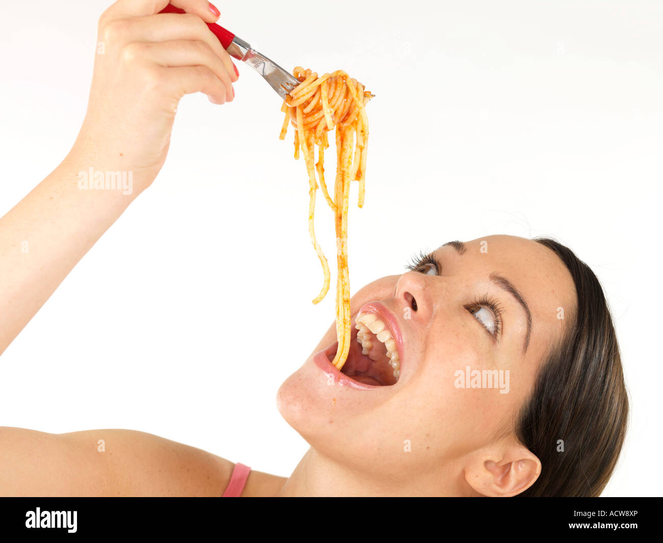 Young Woman Alone Eating And Enjoying Freshly Cooked Italian Style ...