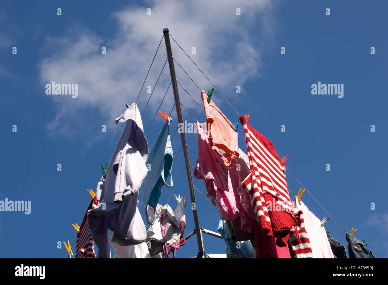 Washing on outdoors line drying in sunshine on a bright sunny day - not ...