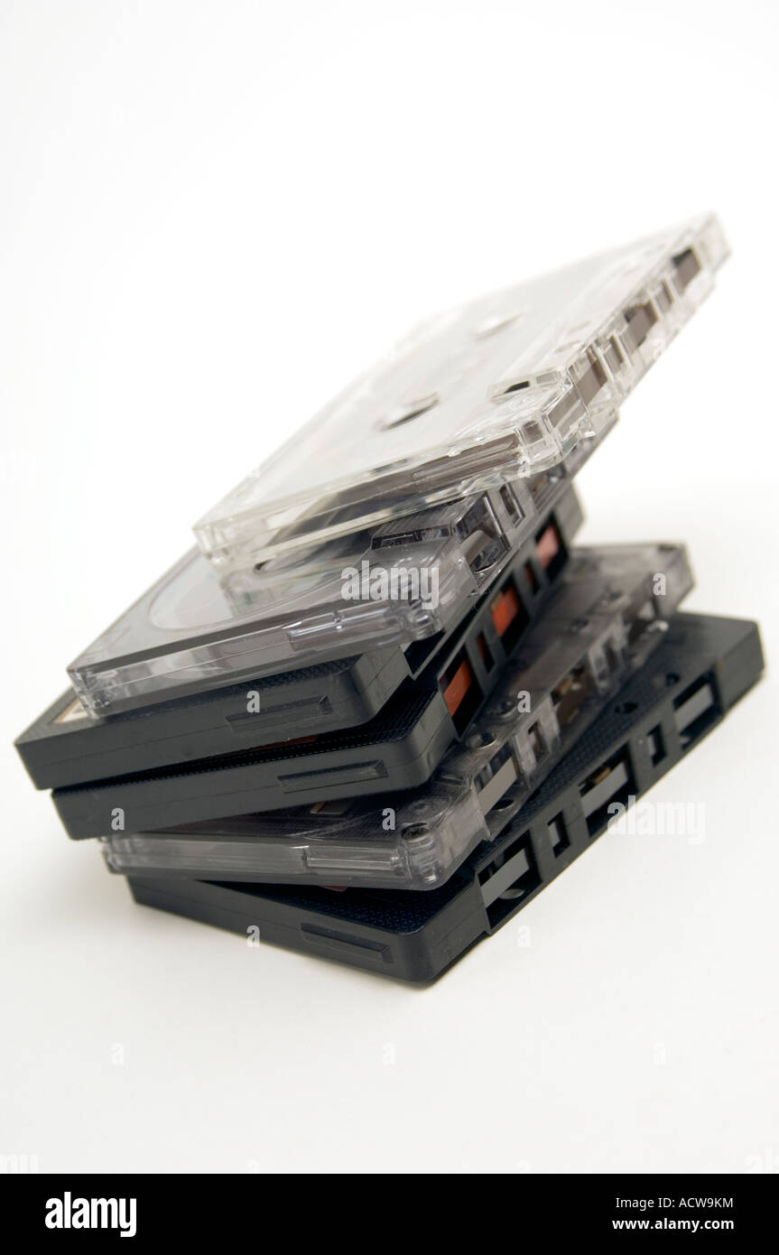 stack of old audio C60 C90 C120 cassette music tapes on white ...