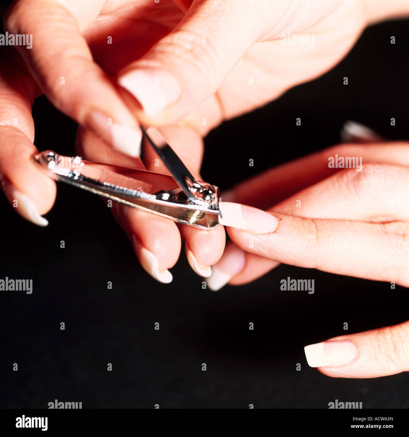 Woman Cutting Nails Model Released Stock Photo - Alamy