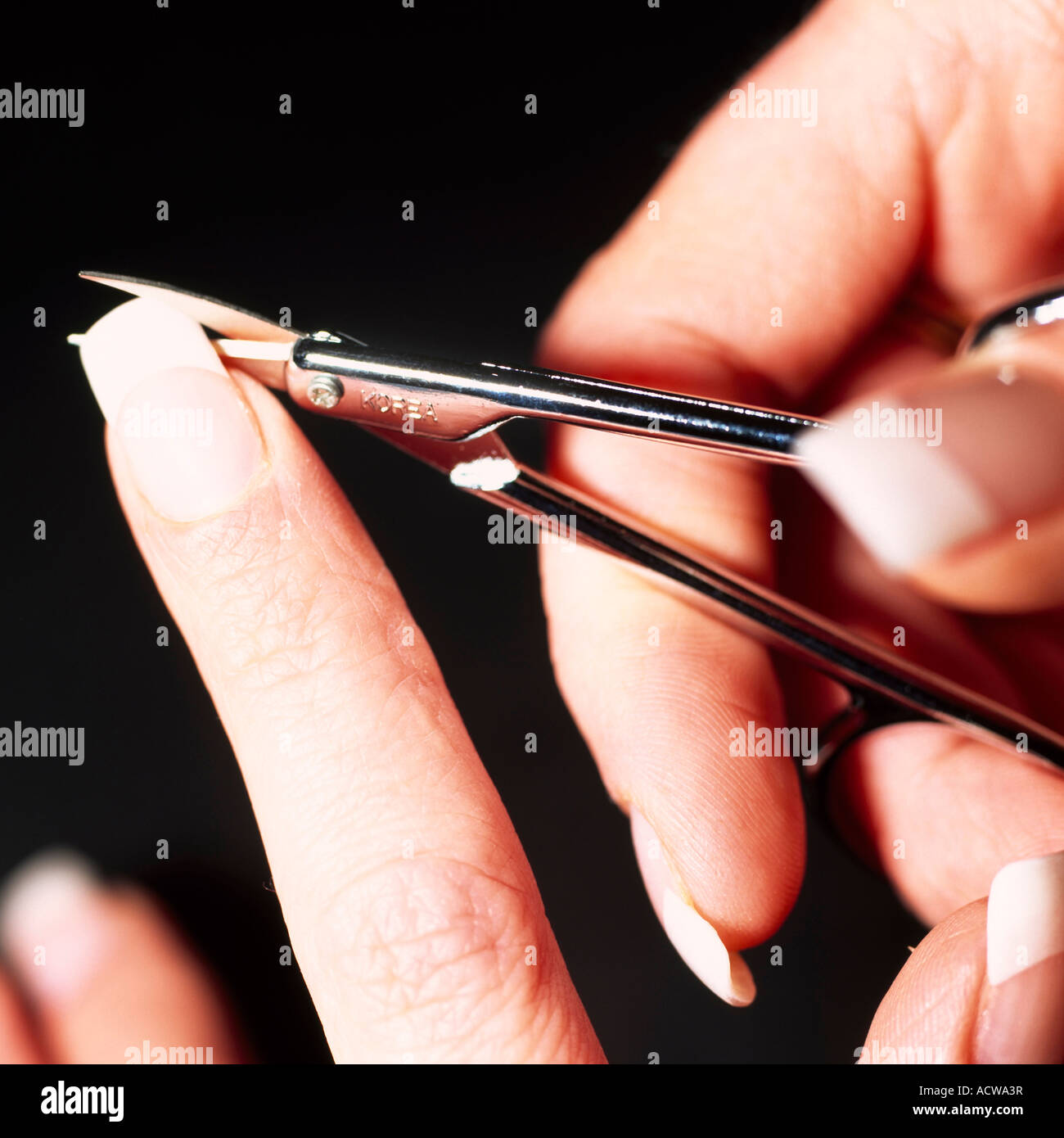 Woman Cutting Nails Model Released Stock Photo - Alamy
