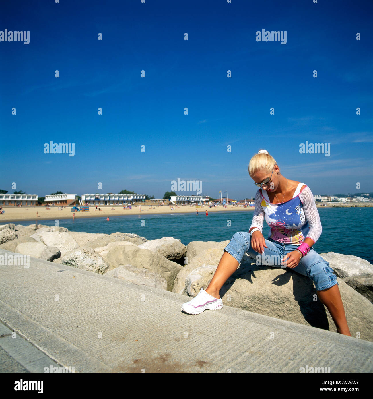 Young Woman Sitting Down Model Released Stock Photo - Alamy