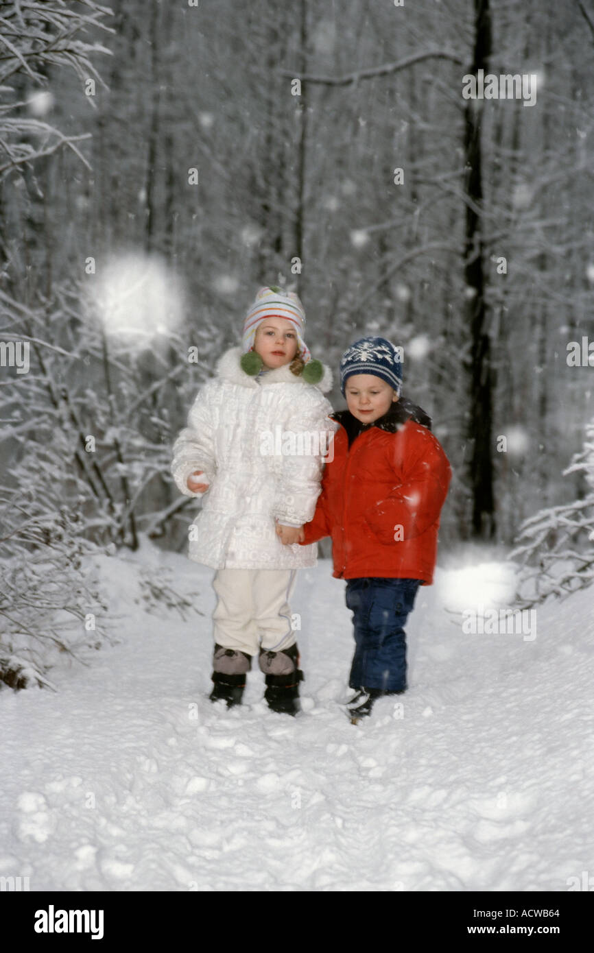 Children standing in a forest Stock Photo - Alamy