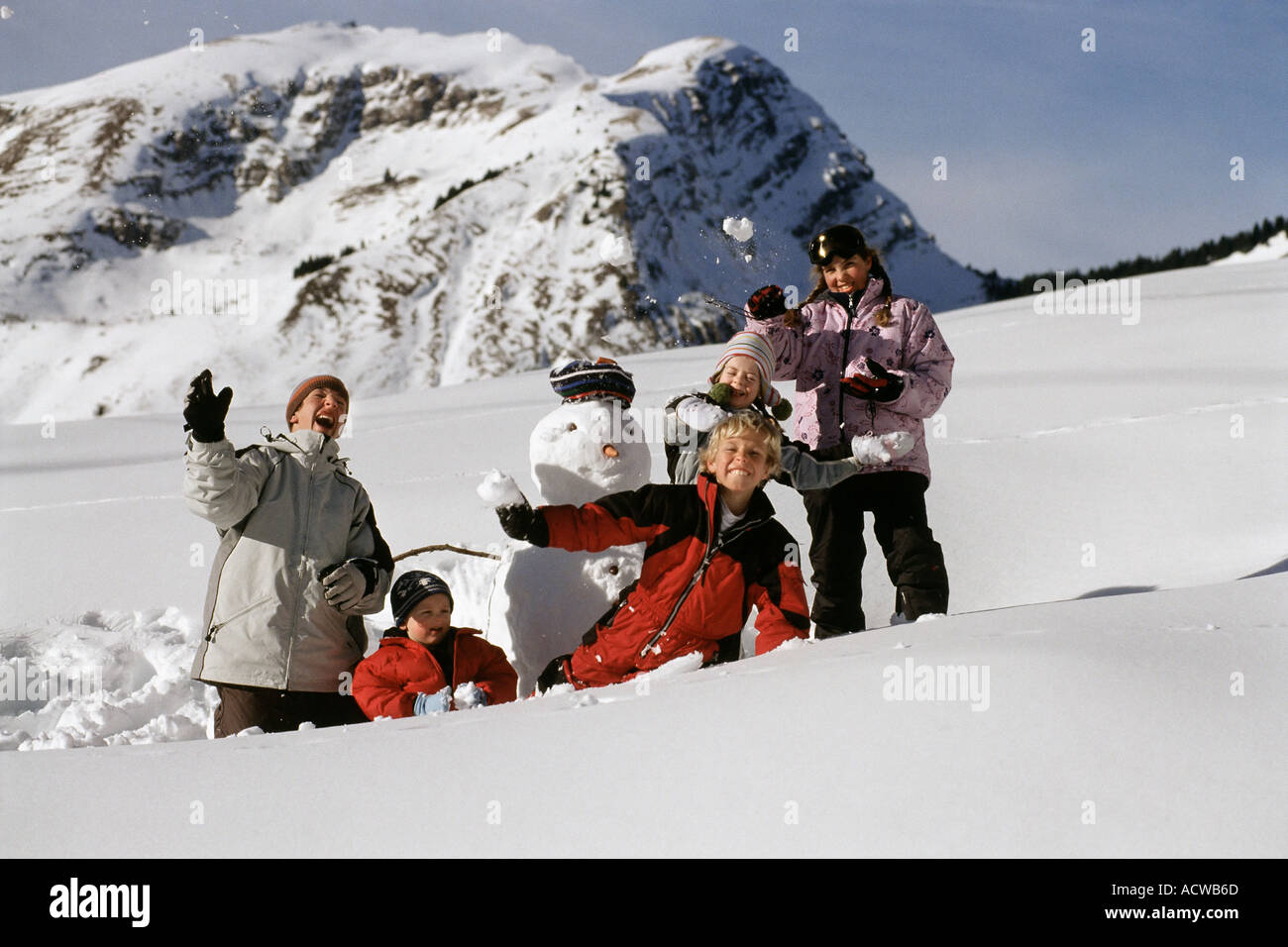 Children playing in snow Stock Photo - Alamy