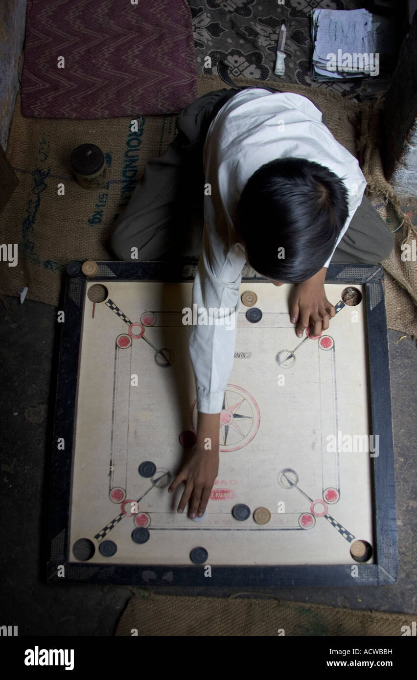 Boy with a table game Varanasi Benares India Stock Photo - Alamy