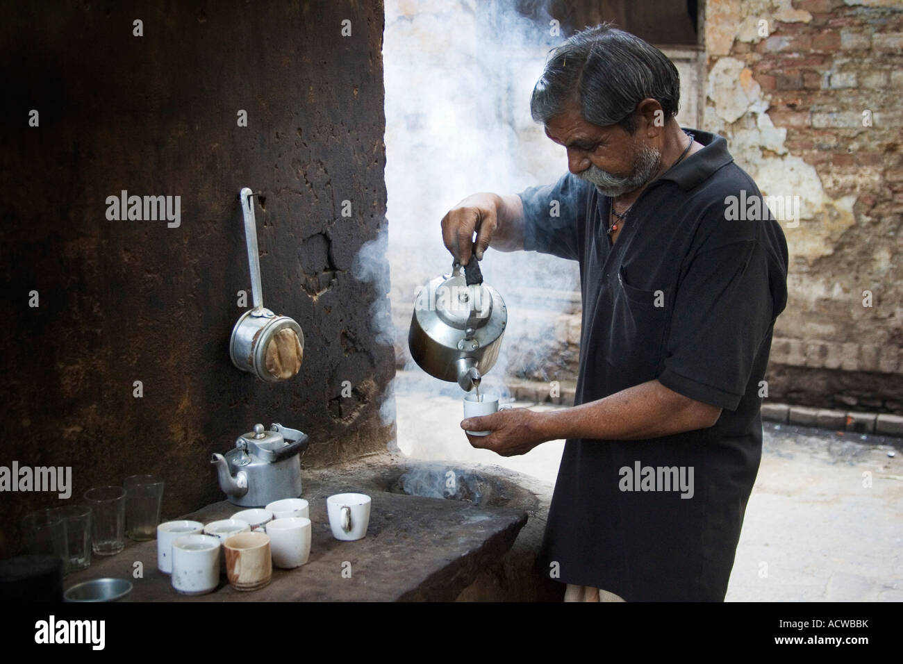 Tea Chai seller on the street Varanasi Benares India Stock Photo - Alamy