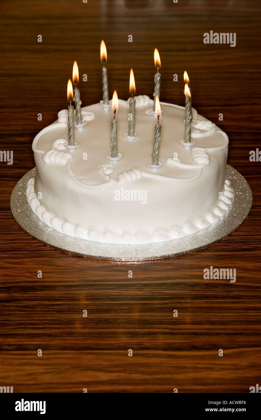 Birthday cake on dining table Stock Photo - Alamy