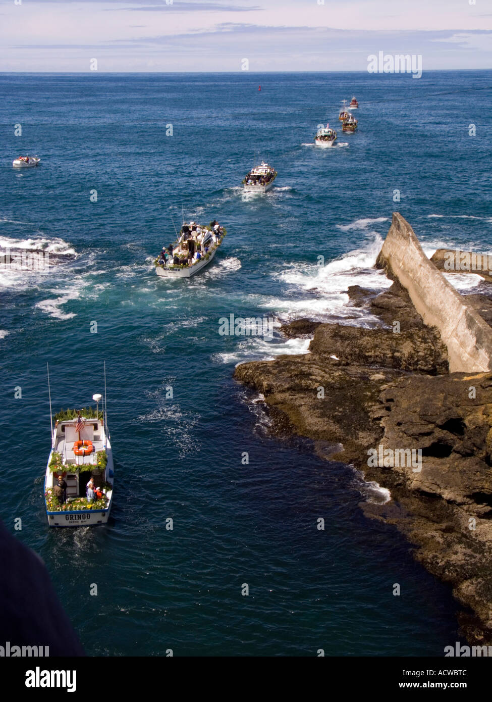 Boats taking part in Fleet of Flowers pass through narrow channel at ...