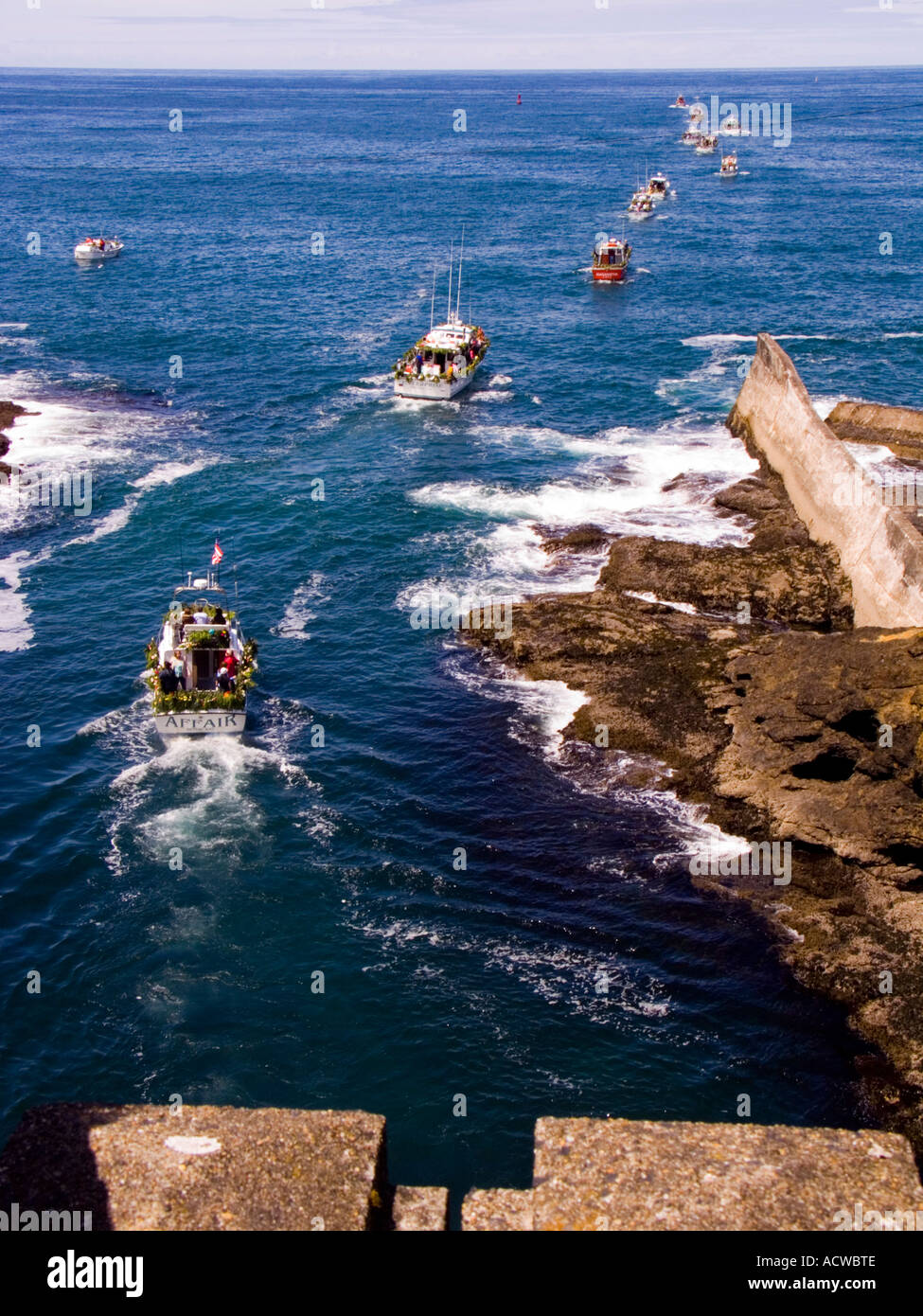 Boats taking part in Fleet of Flowers pass through narrow channel at ...