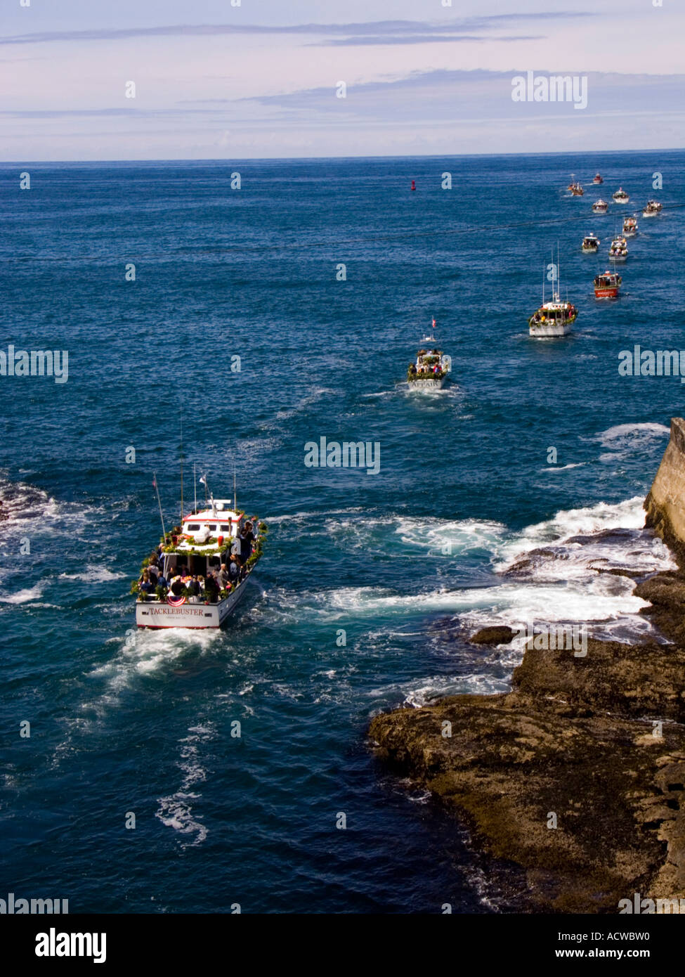 Boats taking part in Fleet of Flowers pass through narrow channel at ...