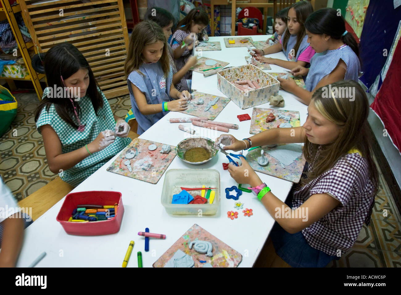 Girls working with clay in a ceramic workshop Stock Photo - Alamy