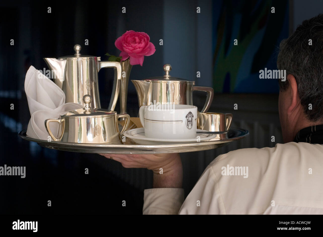 Waiter hands carrying silverware tray with full tea service Stock Photo ...