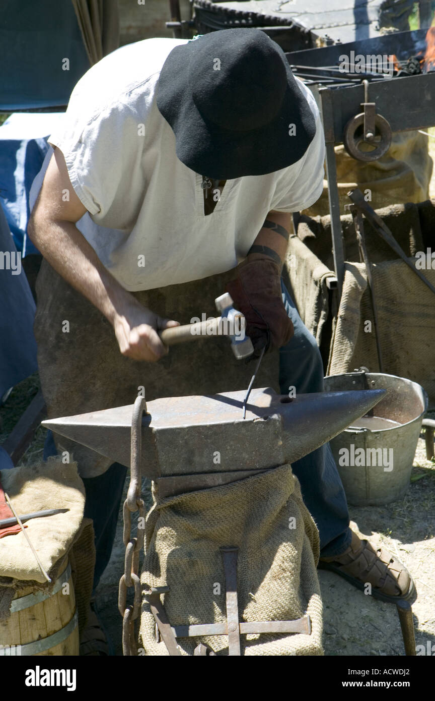 Blacksmith at work at medieval fair at Butron Castle near Gatika ...