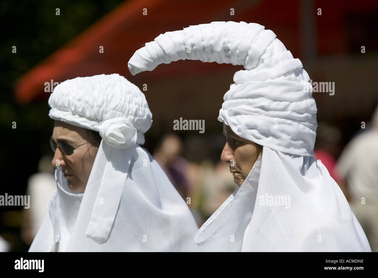 Two women wearing traditional Basque burukoa headdresses, Butron Castle ...