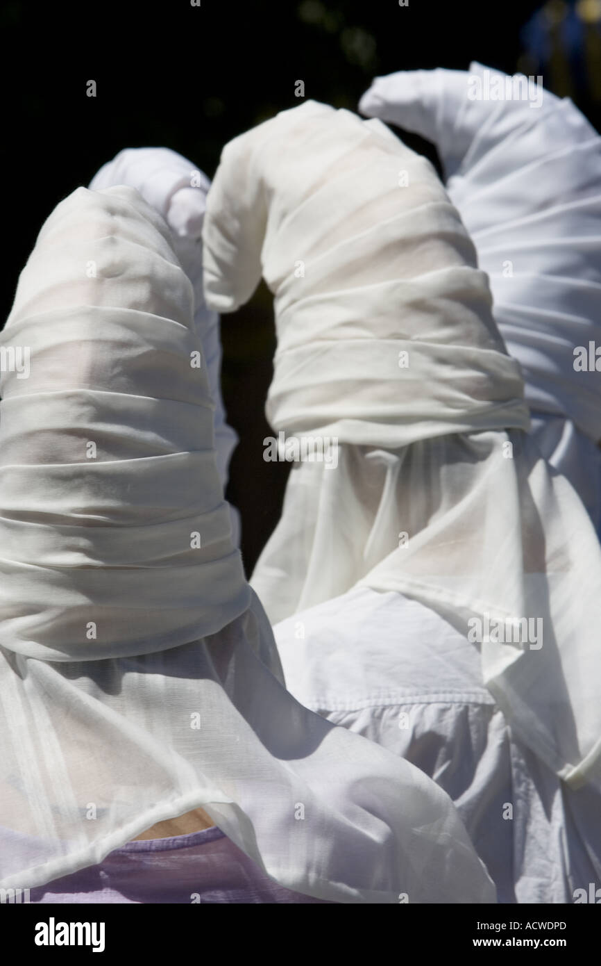 Rear view of women wearing traditional Basque burukoa headdresses ...
