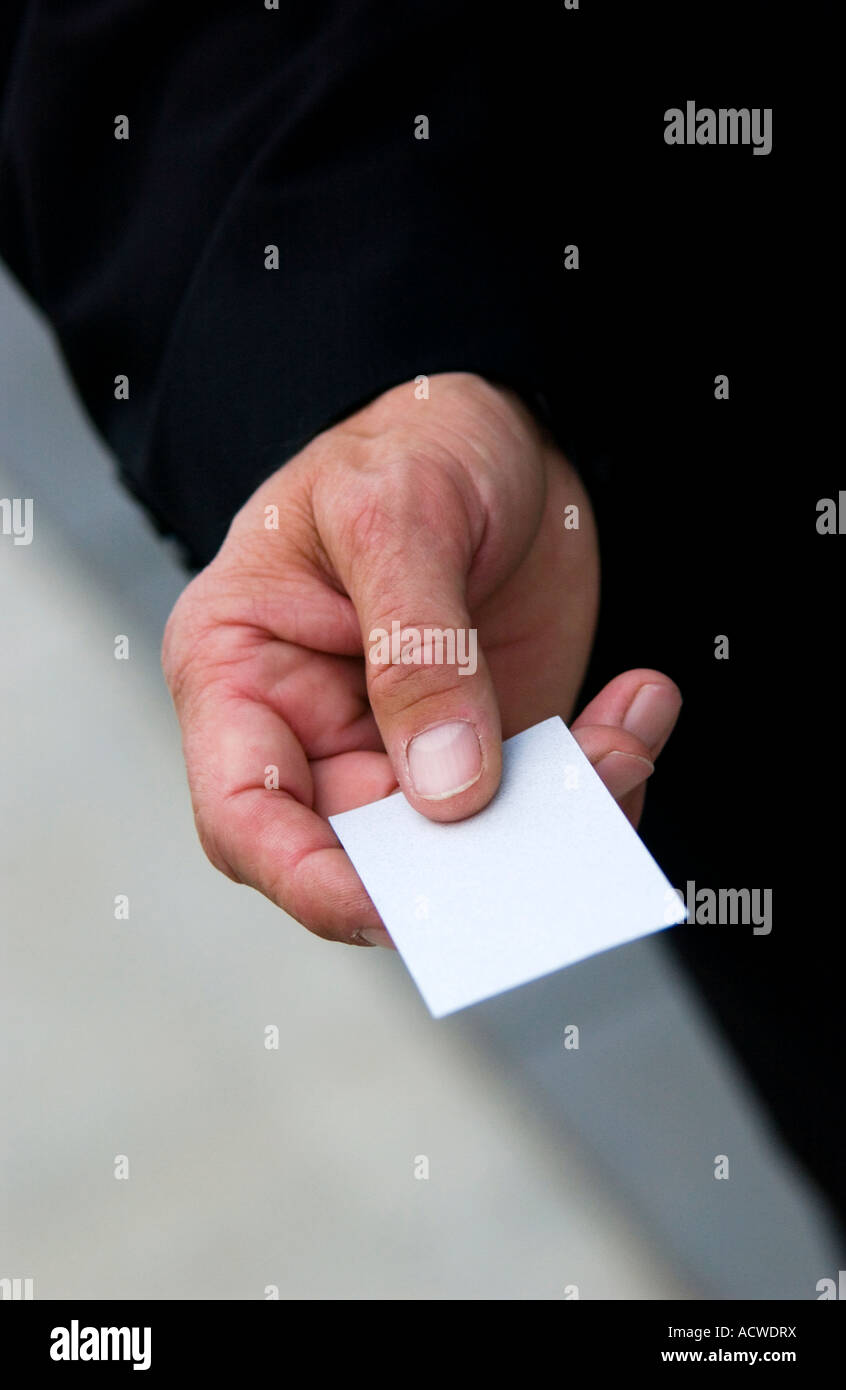 Businessman handing out business card Stock Photo - Alamy