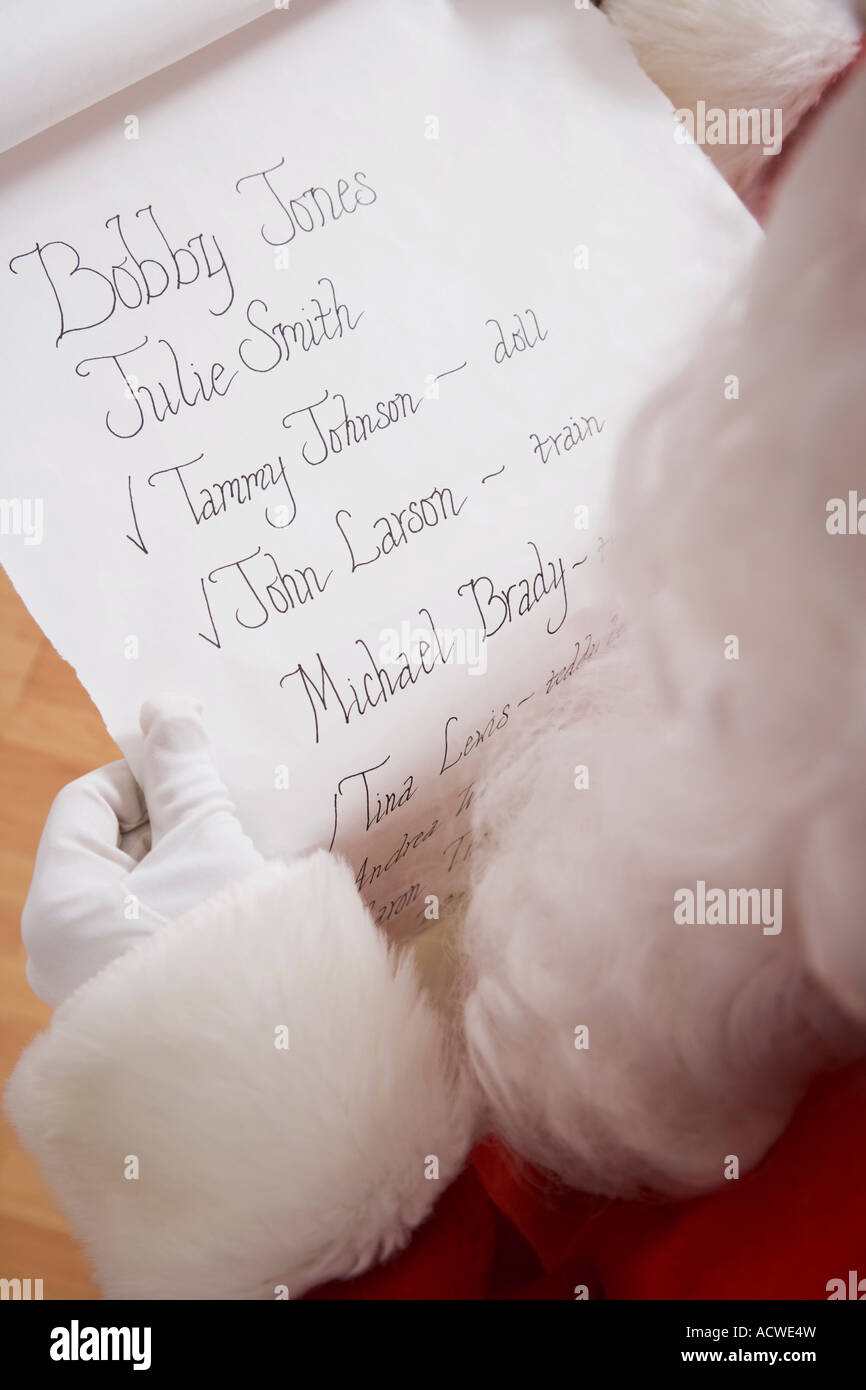 Santa reading his list Stock Photo - Alamy