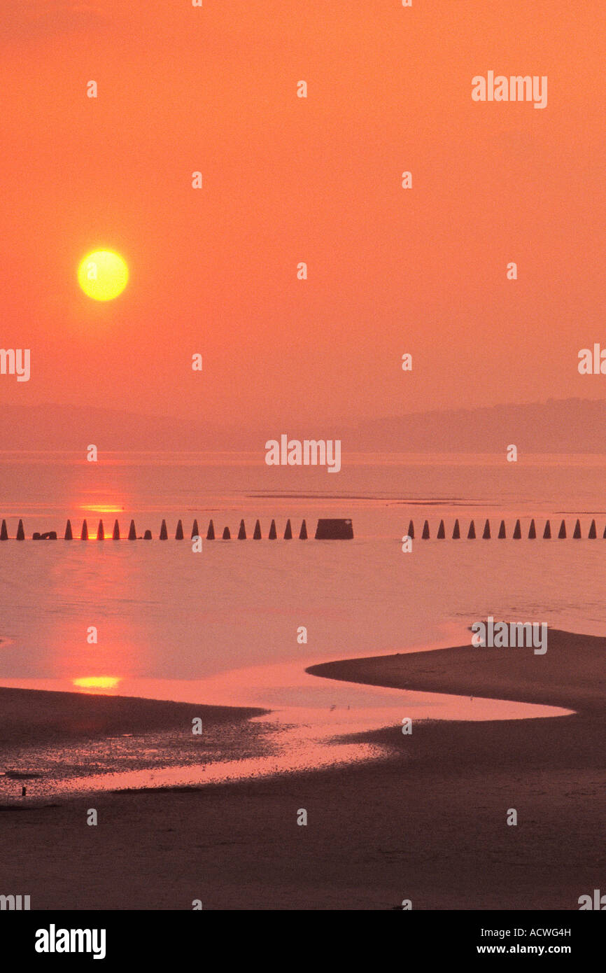 sunset over the foreshore at Cramond showing the causeway to Cramond ...