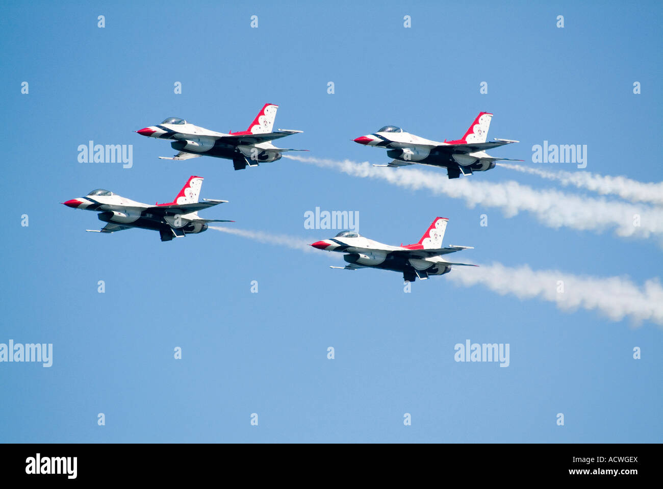FOUR THUNDER BIRD FIGHTER JETS ARE FLYING IN A FORMATION Stock Photo ...