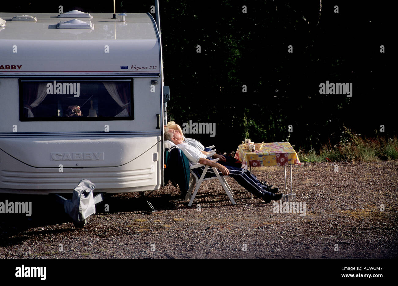 Resting outside camping caravan Stock Photo - Alamy